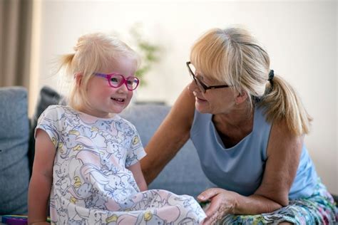 Premium Photo Grandmother And Granddaughter At Home