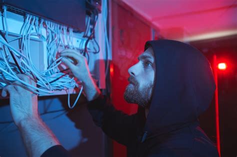 Premium Photo Examining Cables Of Server