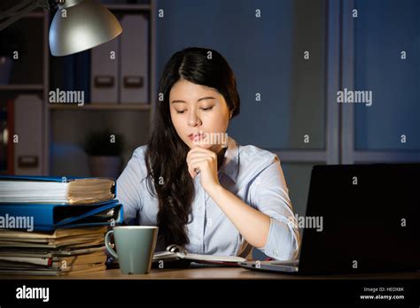 Asian Business Woman Sitting At Desk Working Use Laptop Overtime Late