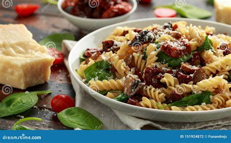 Fusilli Pasta With Sun Dried Tomatoes Mushrooms Parmesan Cheese And