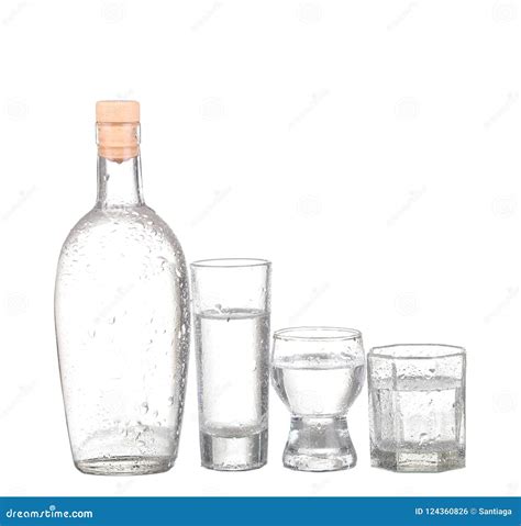 Bottle Of Vodka With Glasses Standing On Ice On Black Background Stock