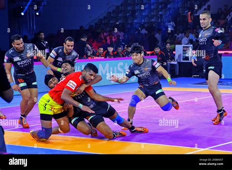 Players Of U Mumba Blue And Gujrat Fortune Giants Red And Yellow
