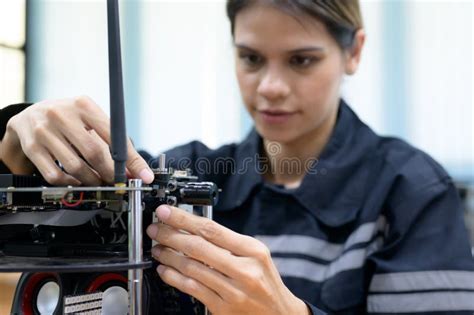 Female Maintenance Engineer Checking And Repairing Automatic Robotic Machine Stock Image Image