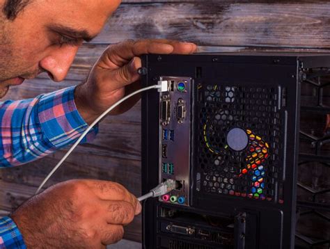 Premium Photo Man Connects Internet Cable To Computer