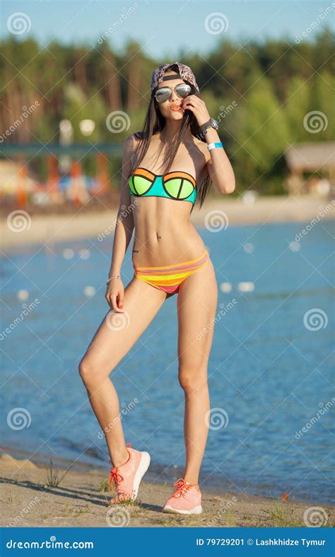Smiling Beautiful Woman Sunbathing On A Beach Focus On Girl Stock Image
