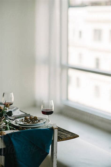 Red Wine Glass On A Fancy Dinner Table Set Up For Thanksgiving By