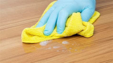 Premium Photo Cropped Hand Cleaning Hardwood Floor