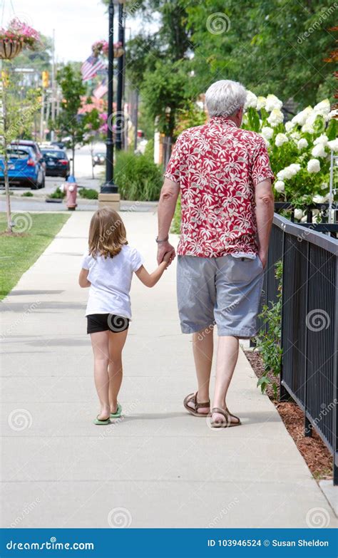 Grandpa Takes Off Wallpaper And Laughing With His Grandson Royalty Free