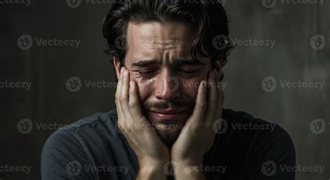 Close Up Of A Distraught Man Crying With Tears Expressing Deep Sadness