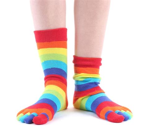 Premium Photo Female Legs In Colorful Striped Socks Isolated On White