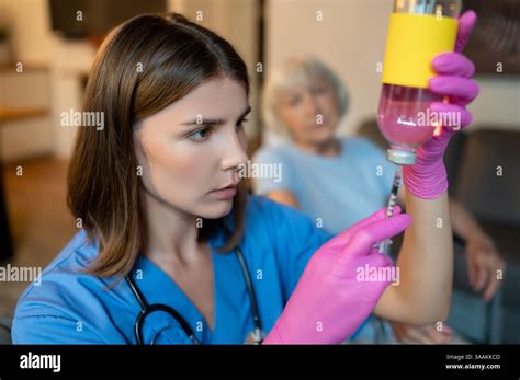Doctor Making Treatment And Intravenous Infusion With Medication To