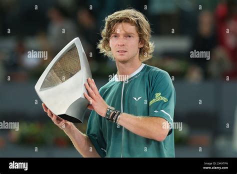 Andrey Rublev Poses With The Mutua Madrid Open Trophy Following Victory