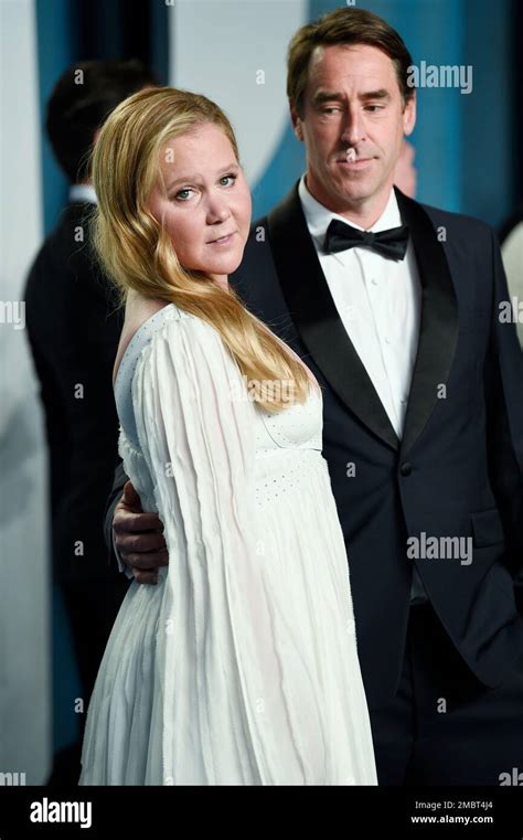 Amy Schumer Left And Chris Fischer Arrive At The Vanity Fair Oscar