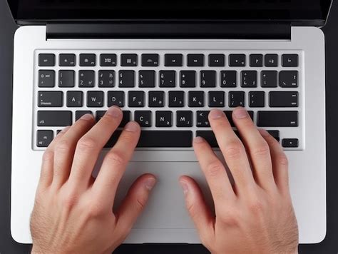 Hands Typing On A Sleek Modern Laptop Keyboard Premium Ai Generated Image
