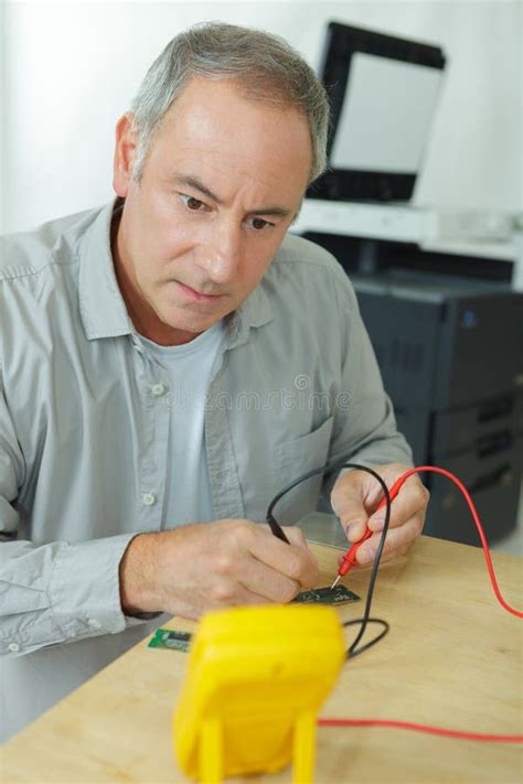 Man Testing Power Using Voltmeter Stock Image Image Of Measuring
