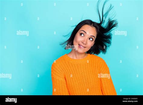Photo Of Dreamy Charming Young Lady Wear Orange Sweater Biting Lip