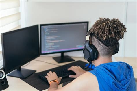 Premium Photo Software Engineer Sitting At Desk And Typing On