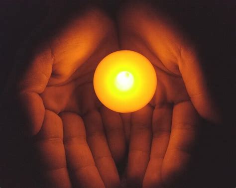 Premium Photo Close Up Of Hand Holding Illuminated Lights