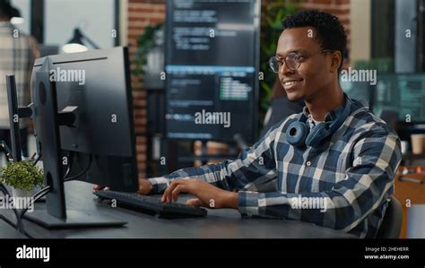 Portrait Of Software Engineer Writing Code Arranging Glasses And Being Happy About Parsing