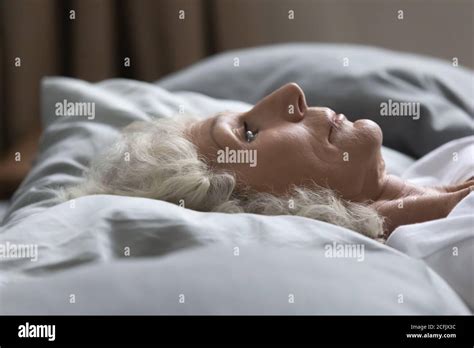 Close Up Upset Sleepless Middle Aged Woman Lying In Bed Stock Photo Alamy
