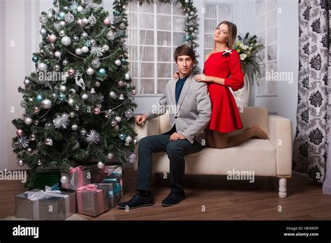 Beautiful Couple At Christmas On The Christmas Tree For New Year Stock