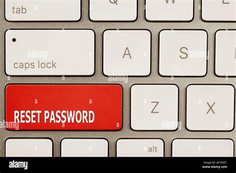 Red Button With Text RESET SECURITY On Keyboard Top View Stock Photo