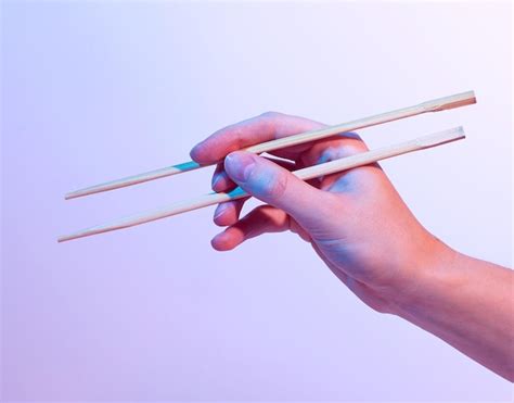 Premium Photo Hands Holding Chinese Sticks Food Chopsticks Neon Light
