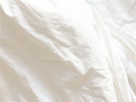 Top View Of The Crease Of An Unmade Bed Sheet In The Bedroom After A