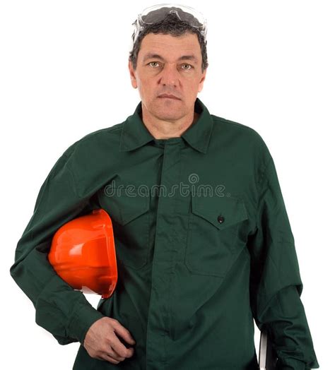 Trabalhador Nos Macacões E Capacete Que Mostra G Diferente Foto de