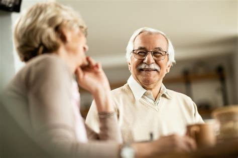 Premium Photo Happy Senior Man Talking To His Wife During Breakfast