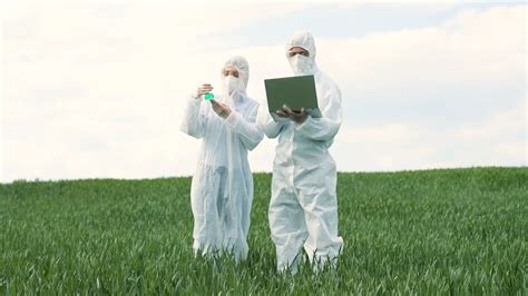 Free Stock Video Caucasian Researchers In Protective Suit Holding A