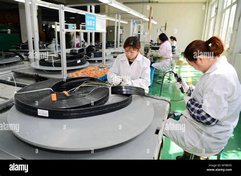 File Female Chinese Workers Produce Cables On The Cable Assembly Line At A Factory Of Nantong