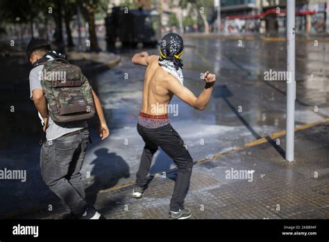Anti Government Protesters Clash With Police In Santiago Chile