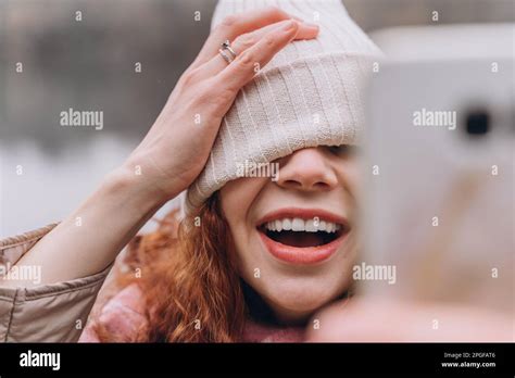 Curly Redhead Woman 30 35 With A Hat Over Her Eyes Take Selfie Stock