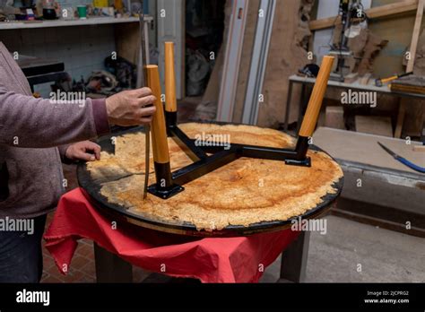 Person Measuring The Distance Of A Table Leg With An Iron Ruler Stock Photo Alamy