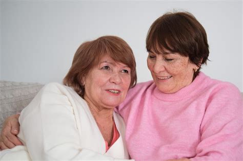 Premium Photo Two Senior Sisters Hugging Representing The Unbreakable