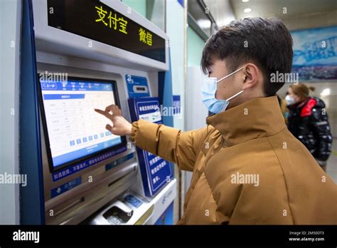 NANJING CHINA DECEMBER 24 2022 Passengers Buy Train Tickets