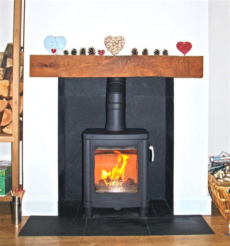 Natural Slate Tiled Chamber And Hearth With Reclaimed Clad Oak Beam And