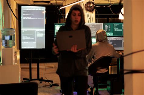 hackers team using computers to plant virus and hack network system
