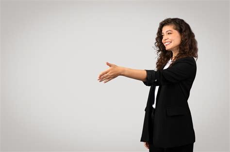 Premium Photo Businesswoman Reaching Out For Handshake Free Space