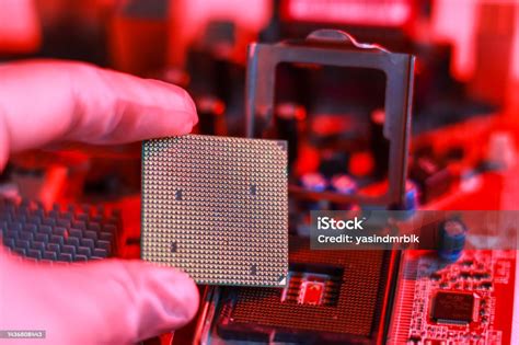 Technician Installing Cpu Chip Microprocessor Socket On Motherboard