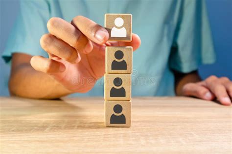 A Man Arranges The Hierarchy Of A Company S Business Organization