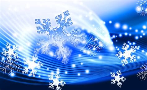 雪片と青い冬の抽象的な背景 プレミアム写真
