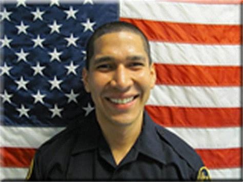 Florida Police Officer Charged With Shooting Unarmed Man Who Had His