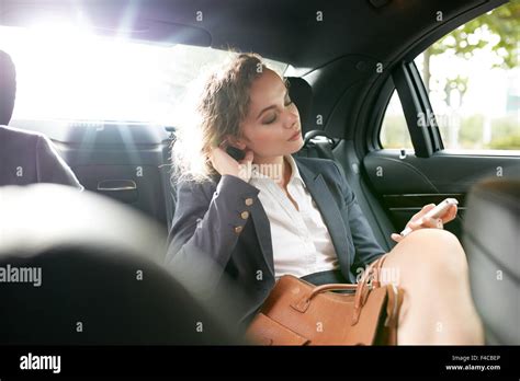 Inside Shot Of A Car With Woman Sitting With Her Eyes Closed On Backseat Female Entrepreneur