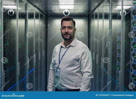 Smiling Engineer In Corridor Of Data Center Stock Image Image Of