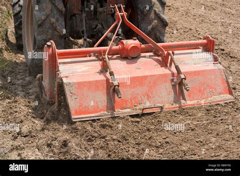 Thai Farmers Are Using A Tractor To Prepare The Soil For Growing Rice
