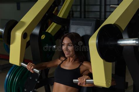 Beautiful Girl Workout On Exercise Machine In Sport Gym Stock Image