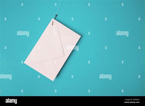White Envelope On The Fish Hook Phishing Email Concept Cyber Security