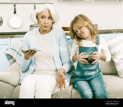 White Haired Italian Grandmother Trying To Understand New Technologies In Granddaughers New
